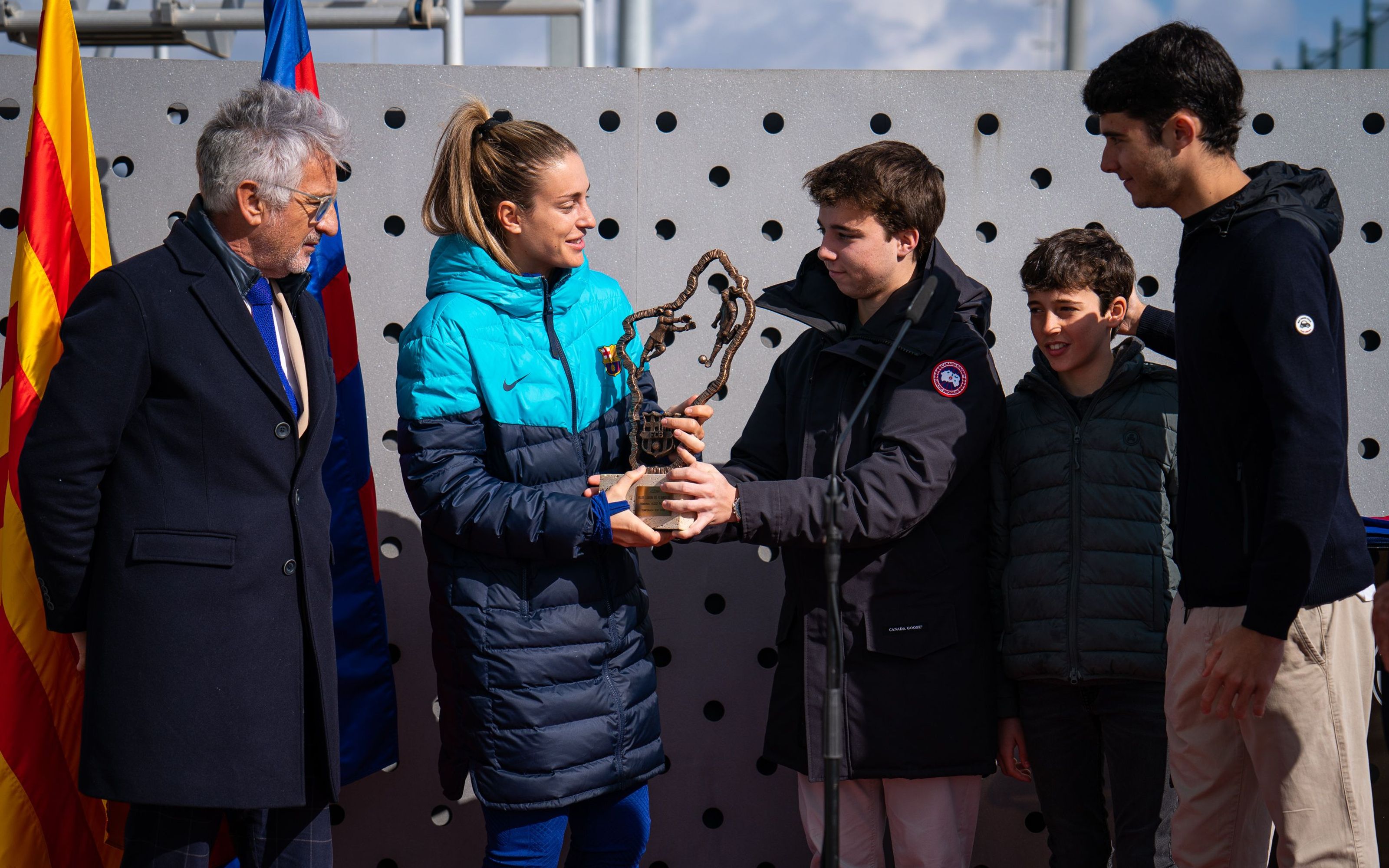 Alexia receiving the Aldo Rovira award in photos