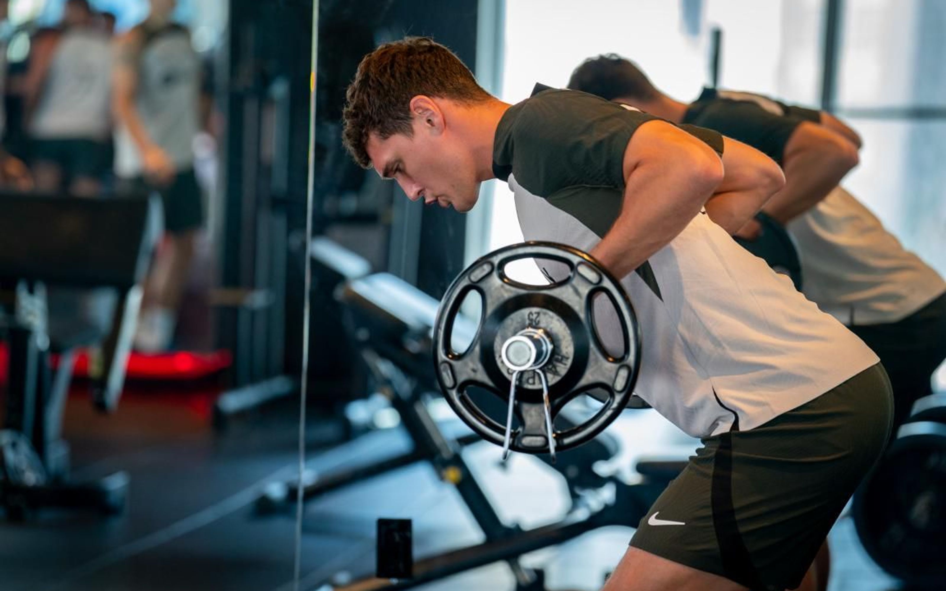 Players work out in gym at team hotel